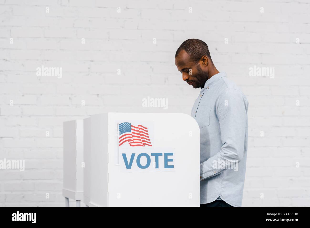 african american citizen voting near stand with vote lettering Stock ...