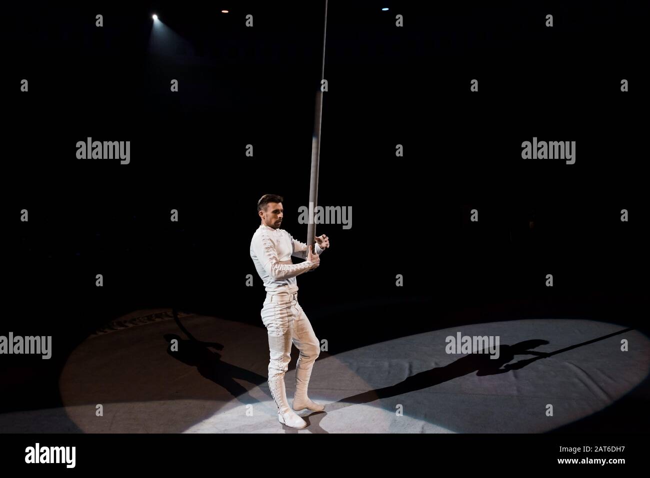 Acrobat standing pole hi-res stock photography and images - Alamy