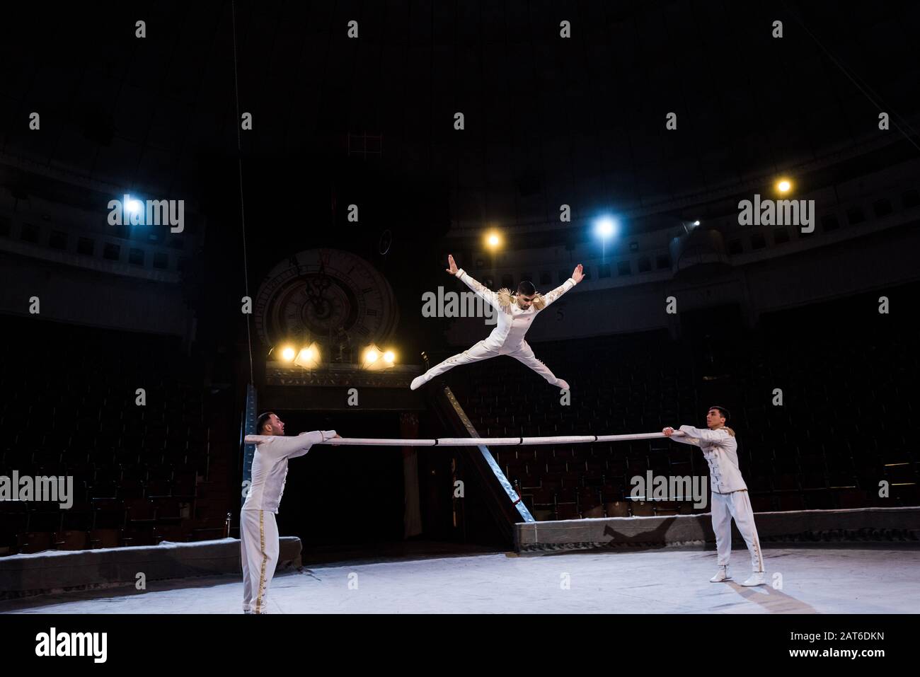 Three acrobats jumping hi-res stock photography and images - Alamy