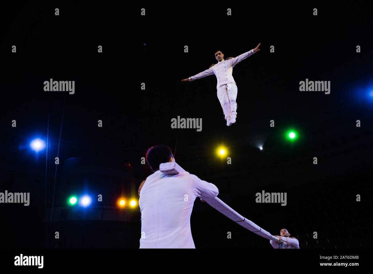 Three acrobats jumping hi-res stock photography and images - Alamy