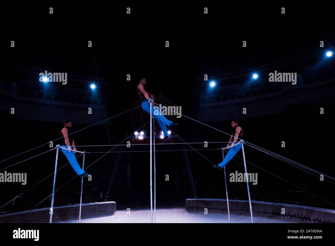 handsome acrobats performing on horizontal bars in circus Stock Photo ...