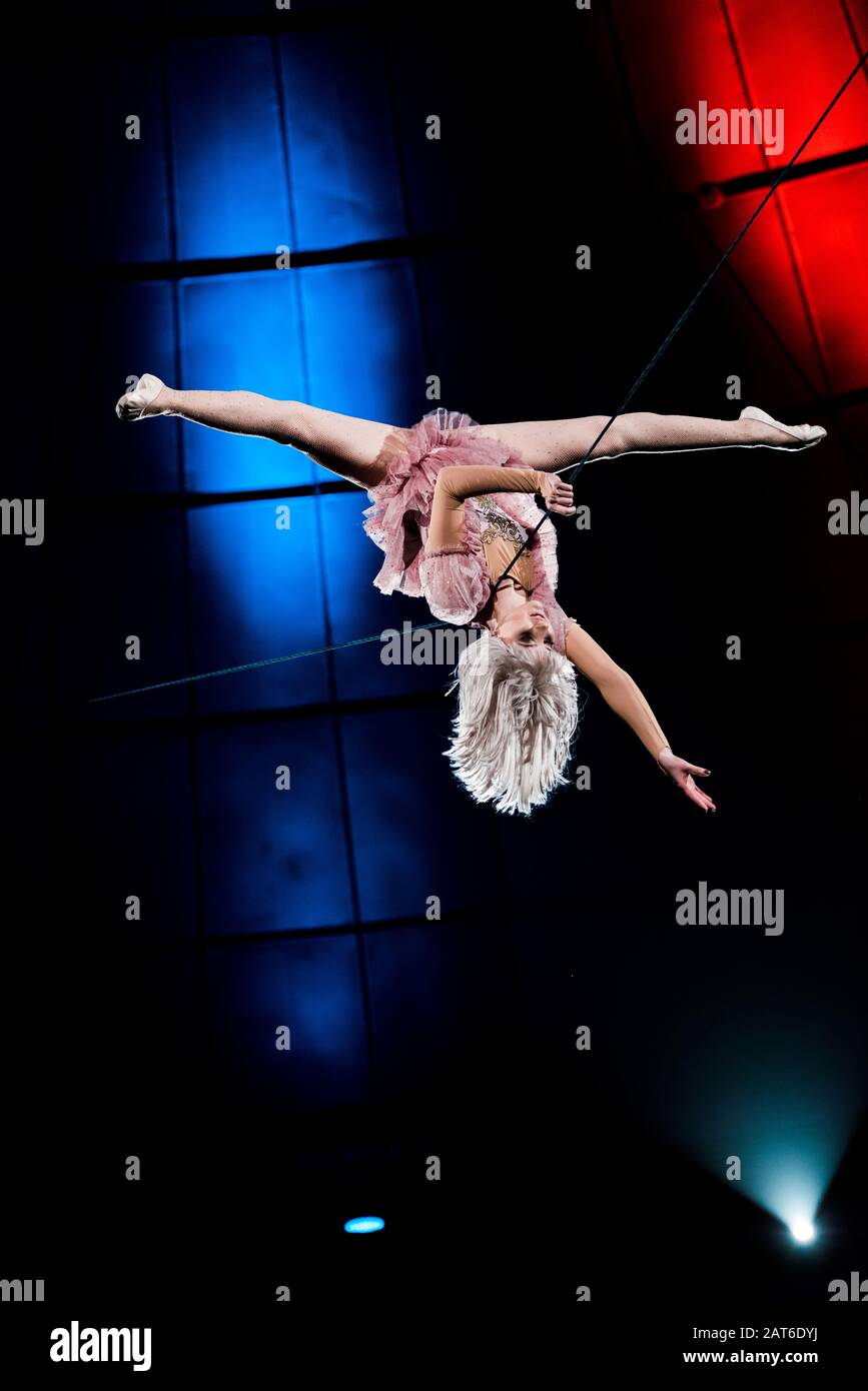 attractive aerial acrobat doing splits while performing in circus Stock ...