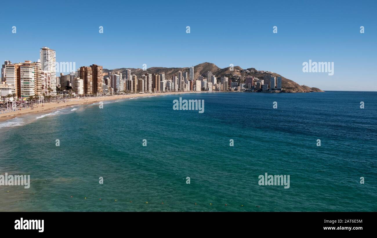 Playa de Levante beach with skyscrapers and Serra Gelada Natural Park ...