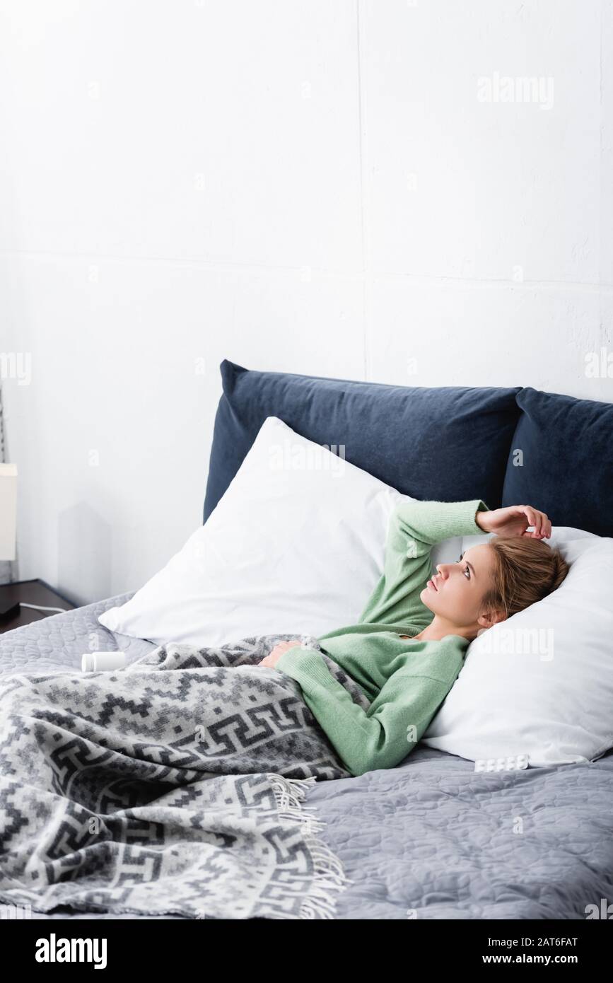 tired woman lying in bed in the morning Stock Photo - Alamy
