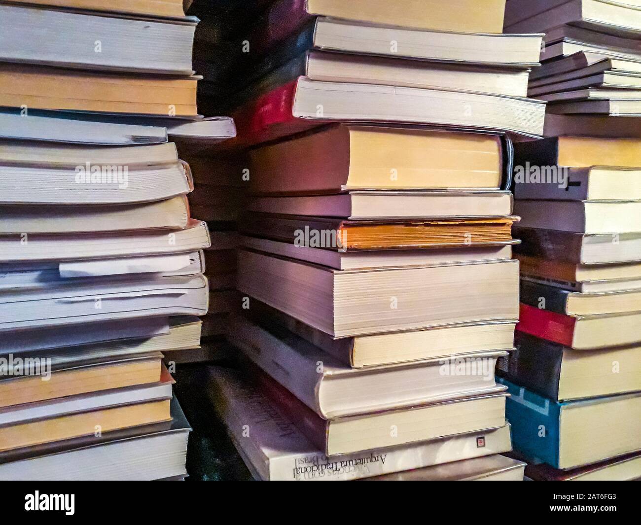 Book pile at interior room house Stock Photo - Alamy
