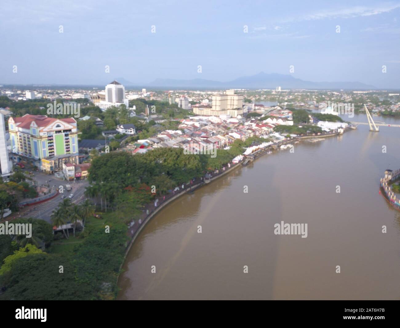 Aerial view of the Kuching city area, with the rivers, bridges, hills ...