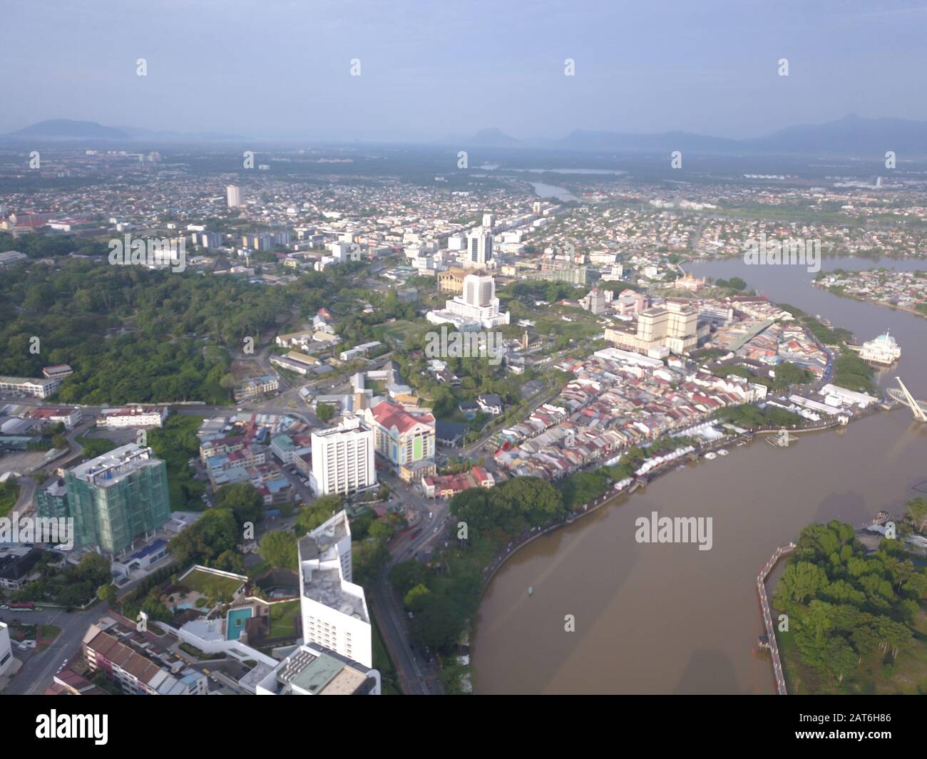 Aerial view of the Kuching city area, with the rivers, bridges, hills ...