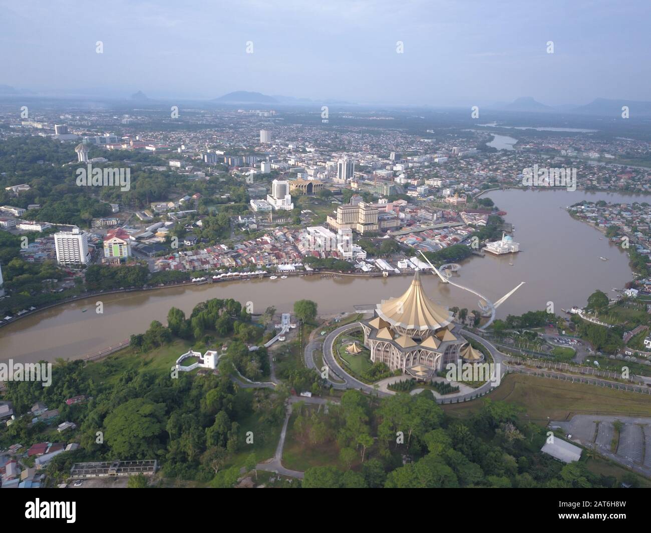 Aerial view of the Kuching city area, with the rivers, bridges, hills ...