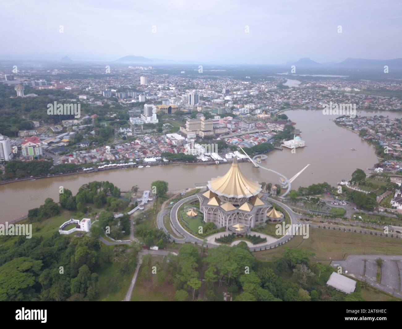 Aerial view of the Kuching city area, with the rivers, bridges, hills ...