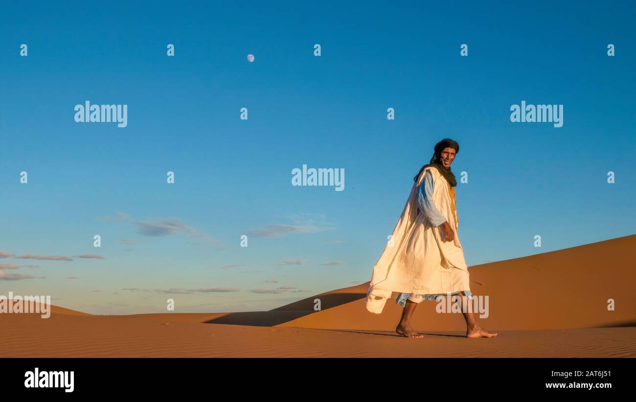 Sahara Desert, Morocco - Oct. 25, 2015. A Moroccan man wearing the ...