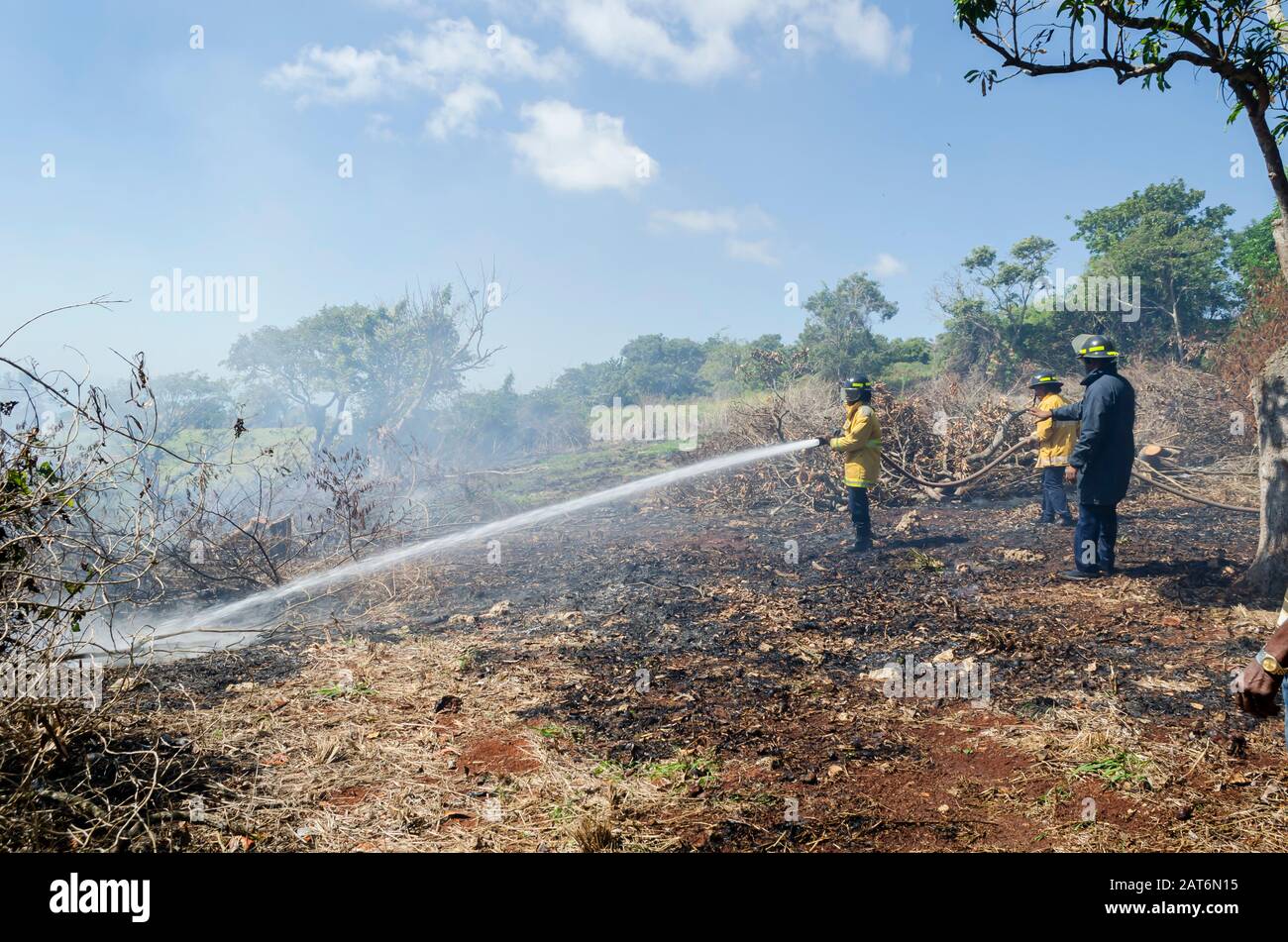 Firemen Cooling Fire Stock Photo - Alamy