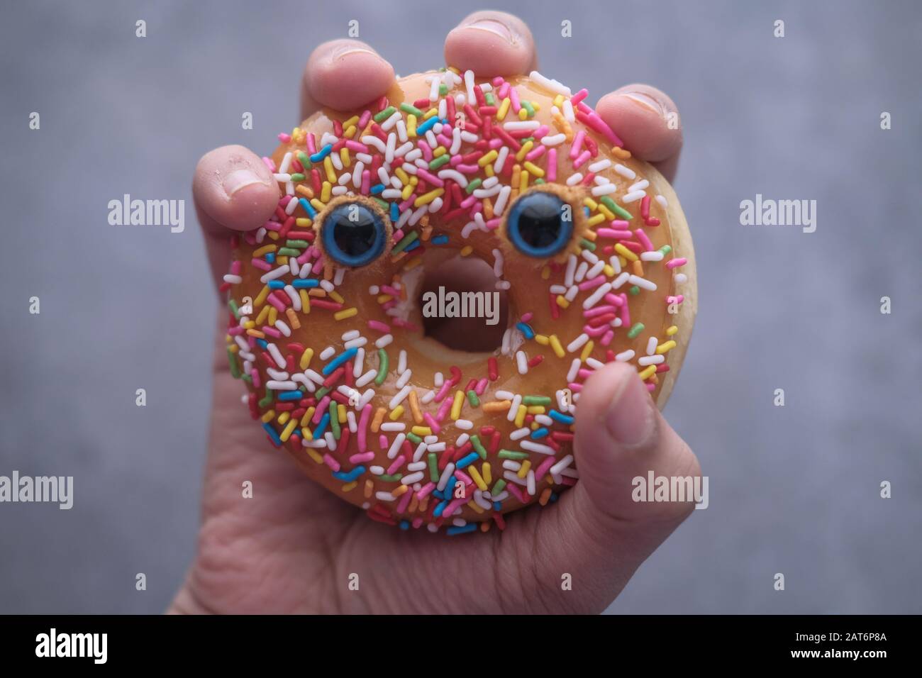 Close up of donut with funny face Stock Photo - Alamy
