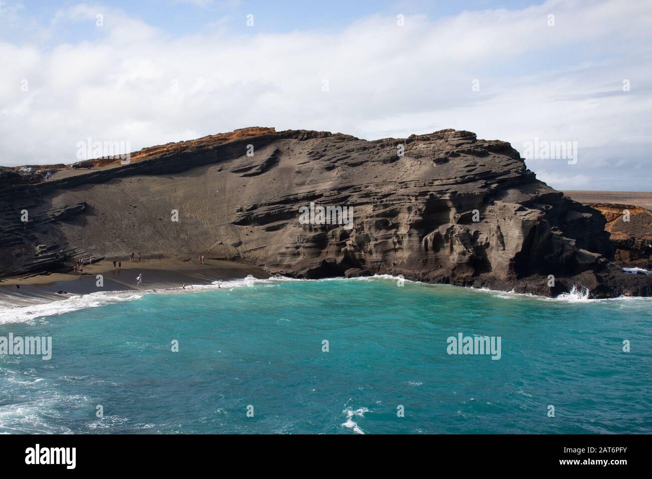 Green sand beach cliff and bay Stock Photo - Alamy