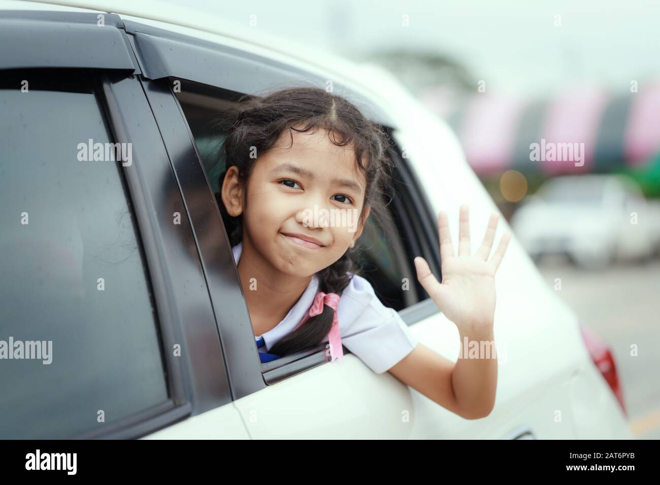 Portrait little Asian girl in Thai student kindergarten uniform smiling ...