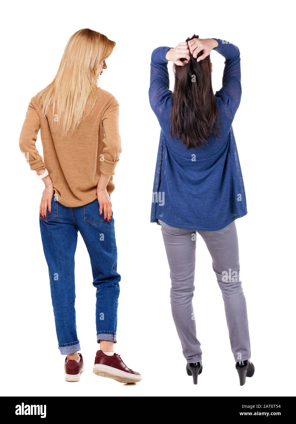 Back view of two woman in sweater. beautiful friendly girl and guy ...