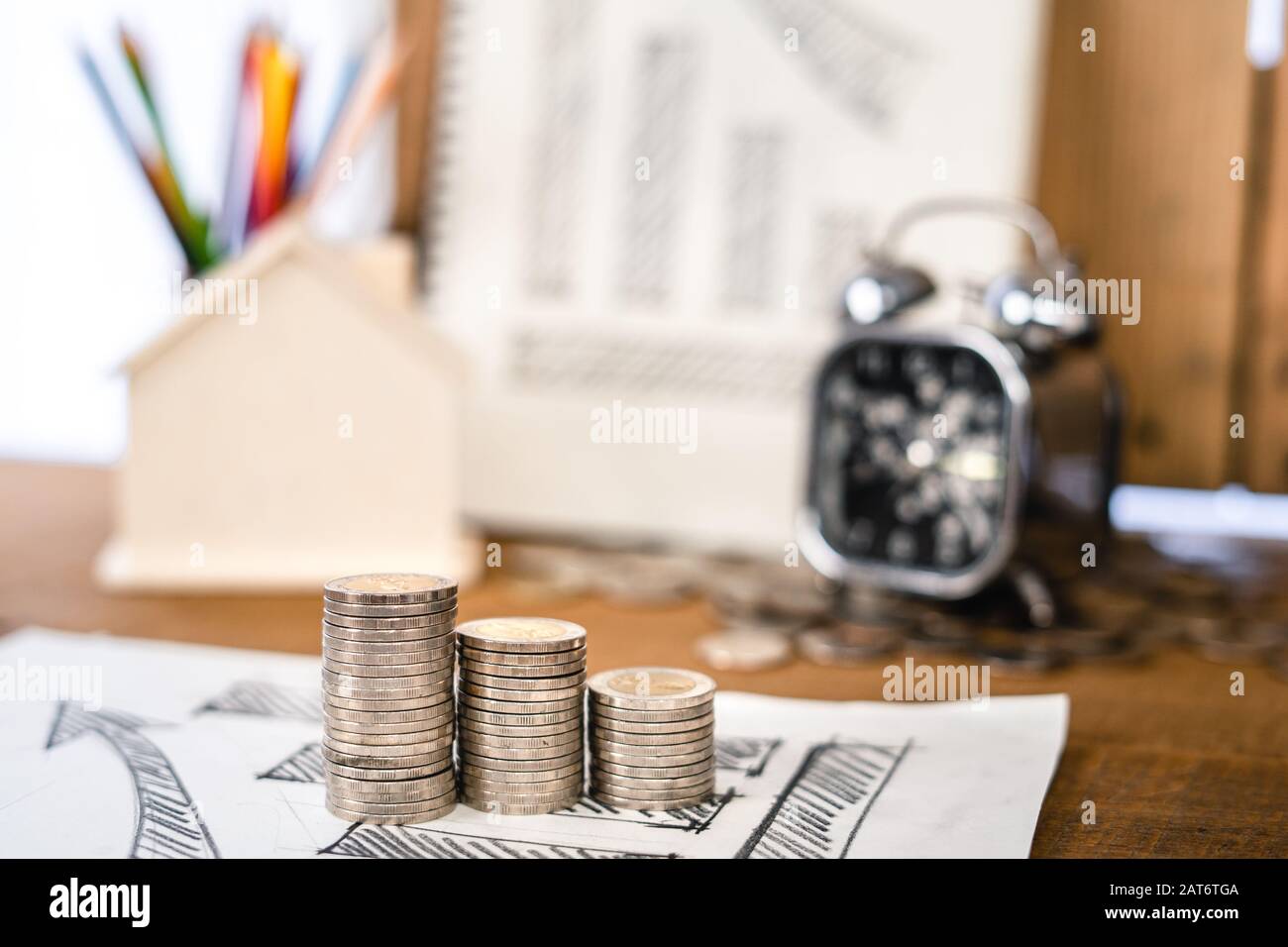 Money growing concept-Money and income graph drawing On Home office ...