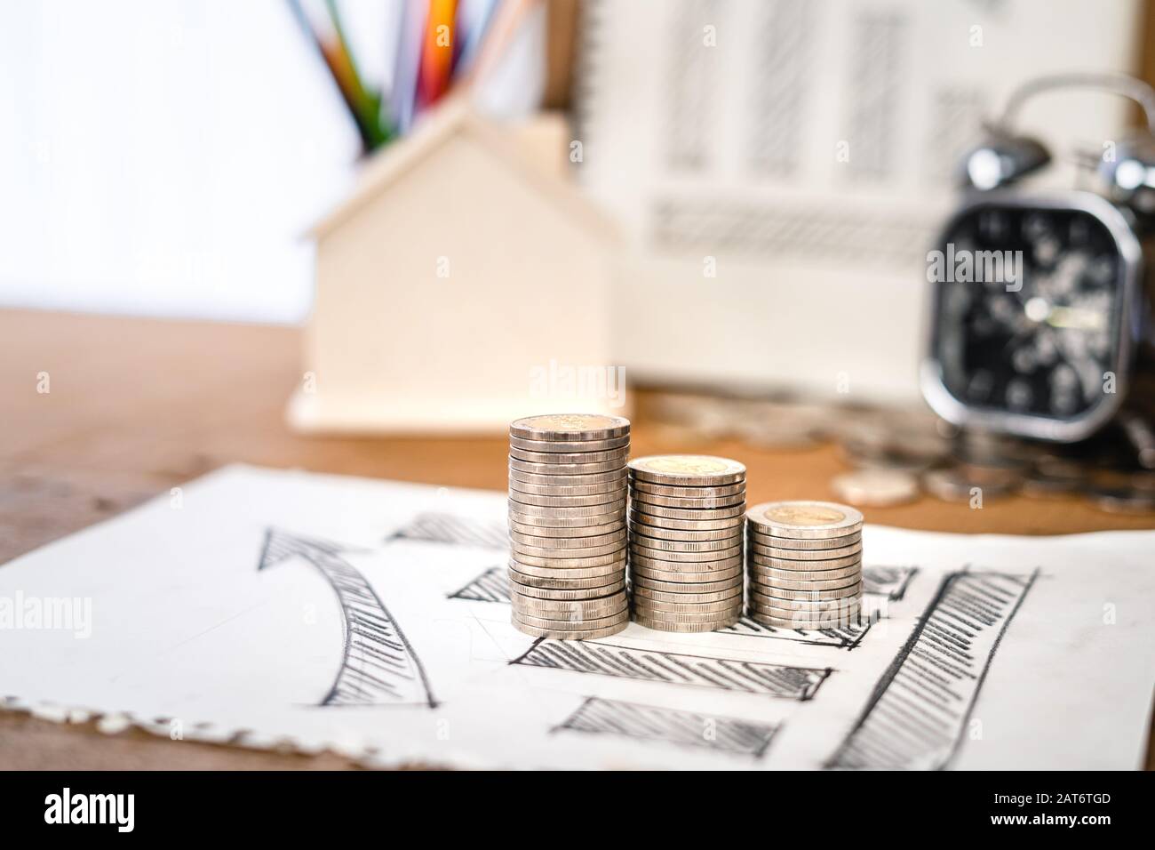 Money growing concept-Money and income graph drawing On Home office ...