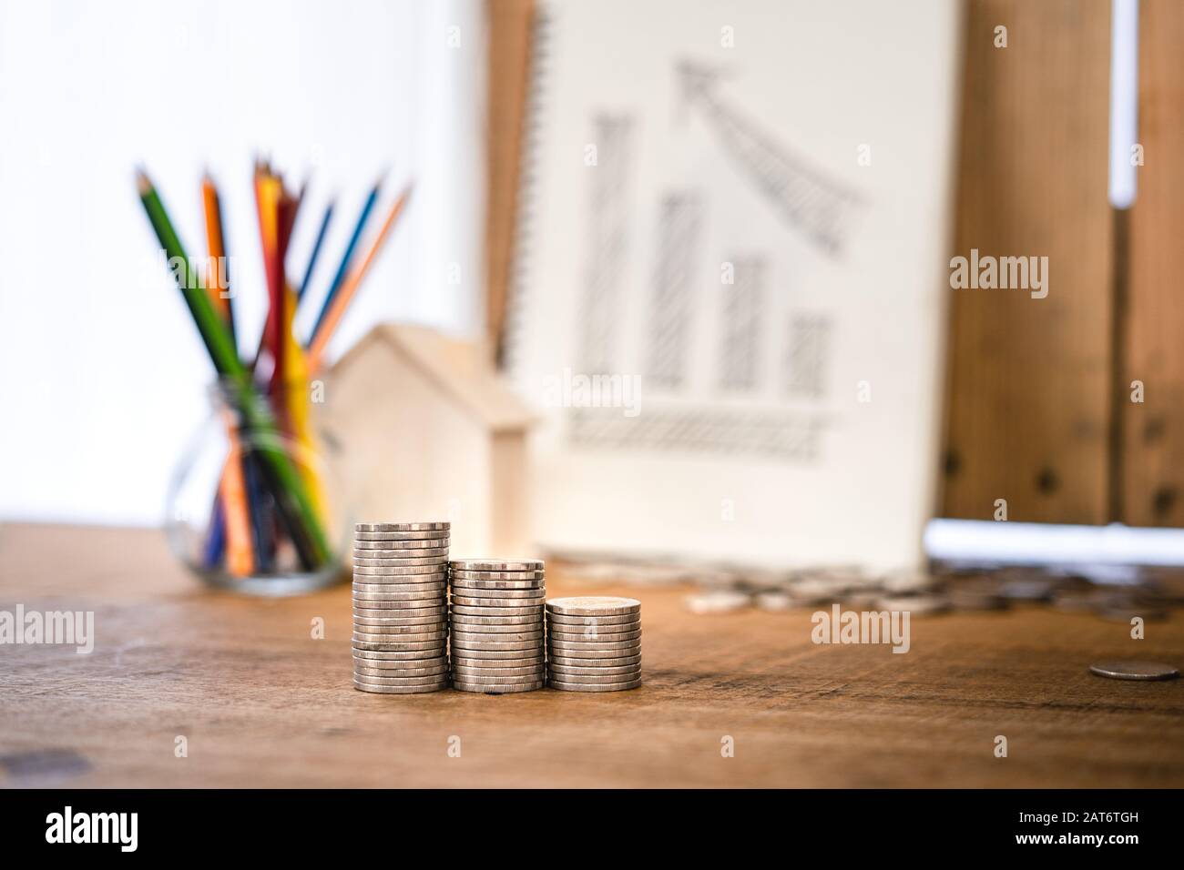 Money growing concept-Money and income graph drawing On Home office ...