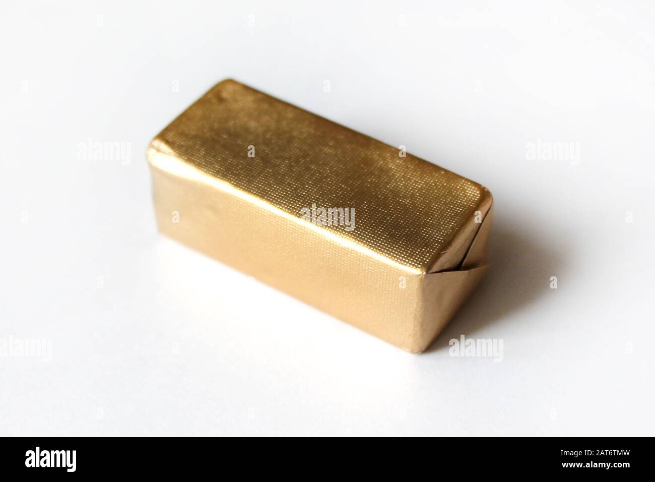 Rectangle chocolate candy wrapped in blue foil isolated on white ...