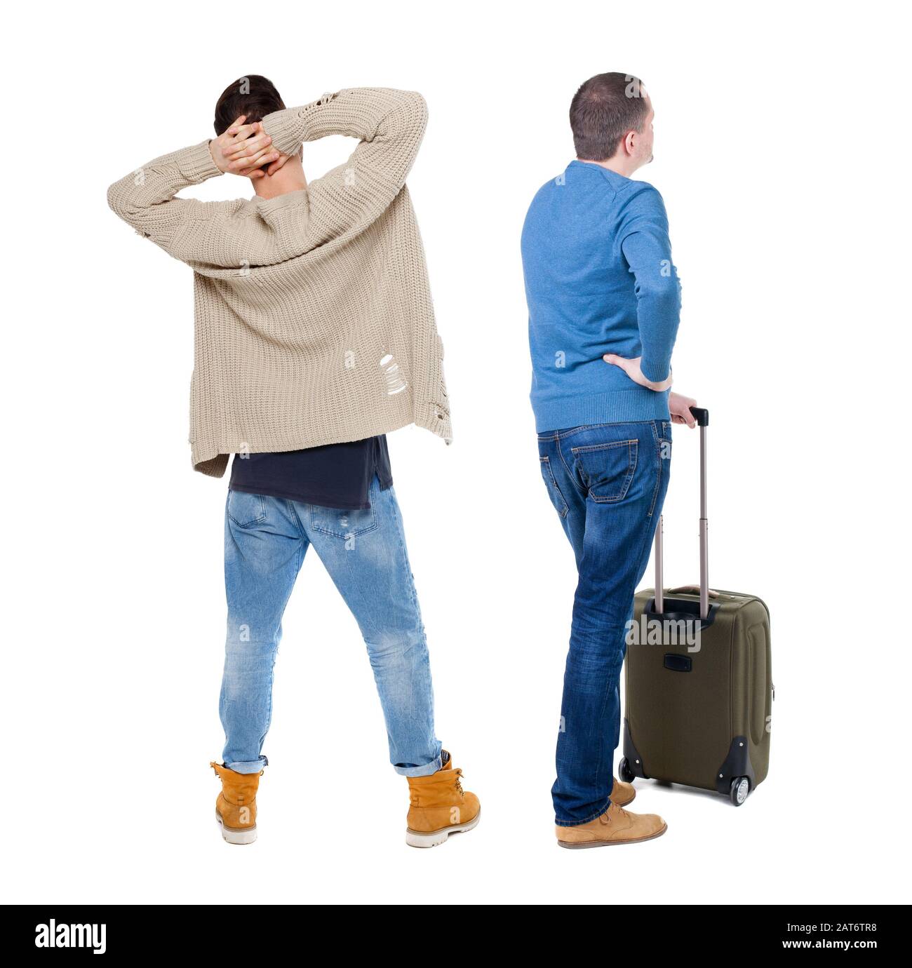 Back view of two man in sweater traveling with suitcas. Back view. Rear ...