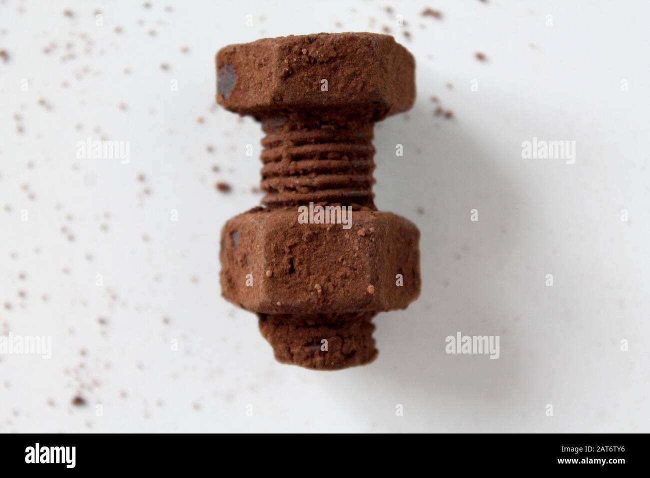 Rusty bolt and nut made of chocolate isolated on white background ...