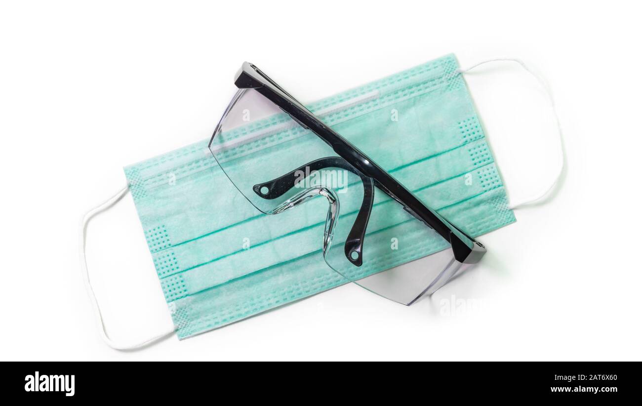 The close up of Anti-viral protection mask and Eye protection glasses ...