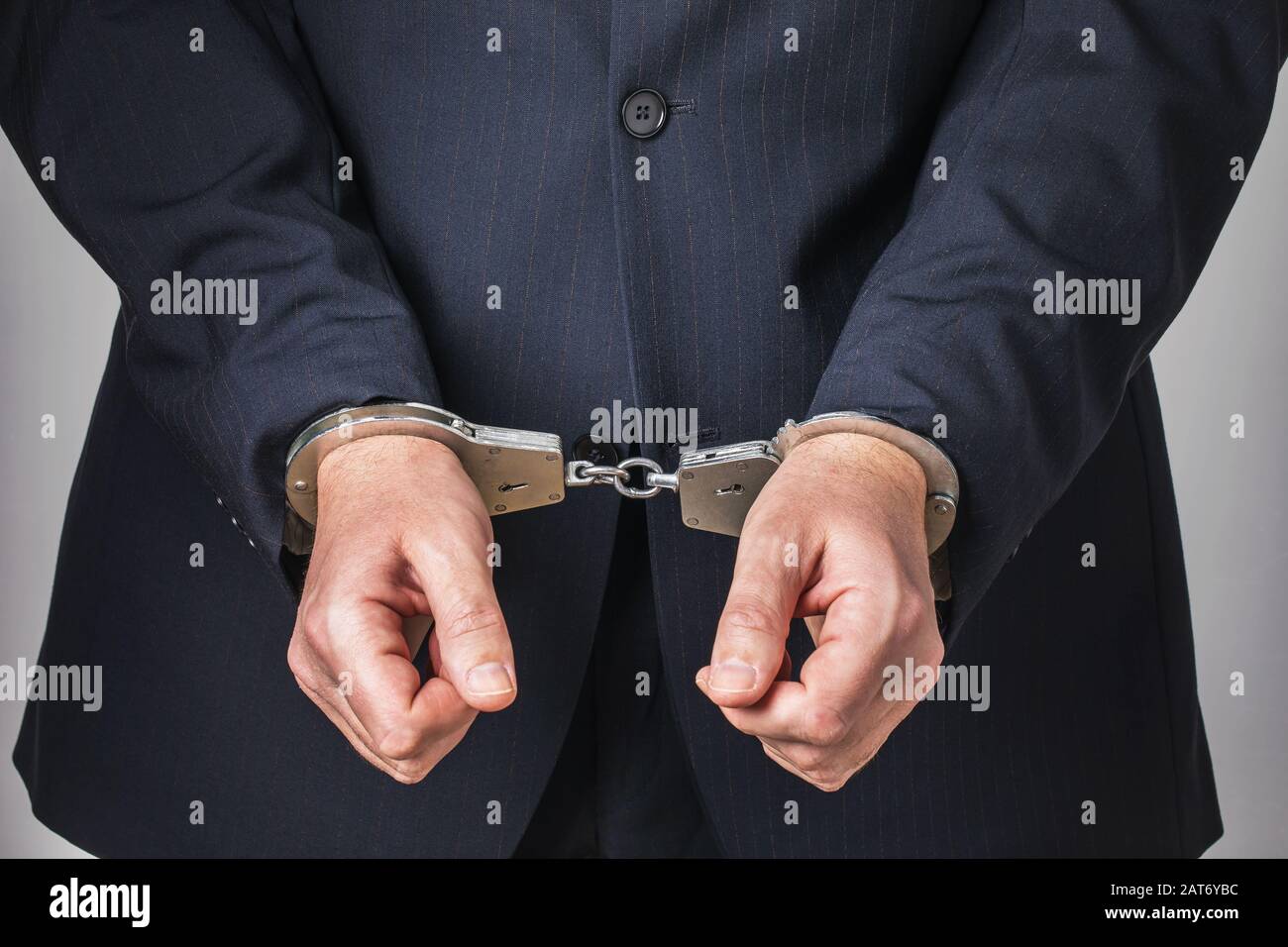 Man suit handcuffs hi-res stock photography and images - Alamy