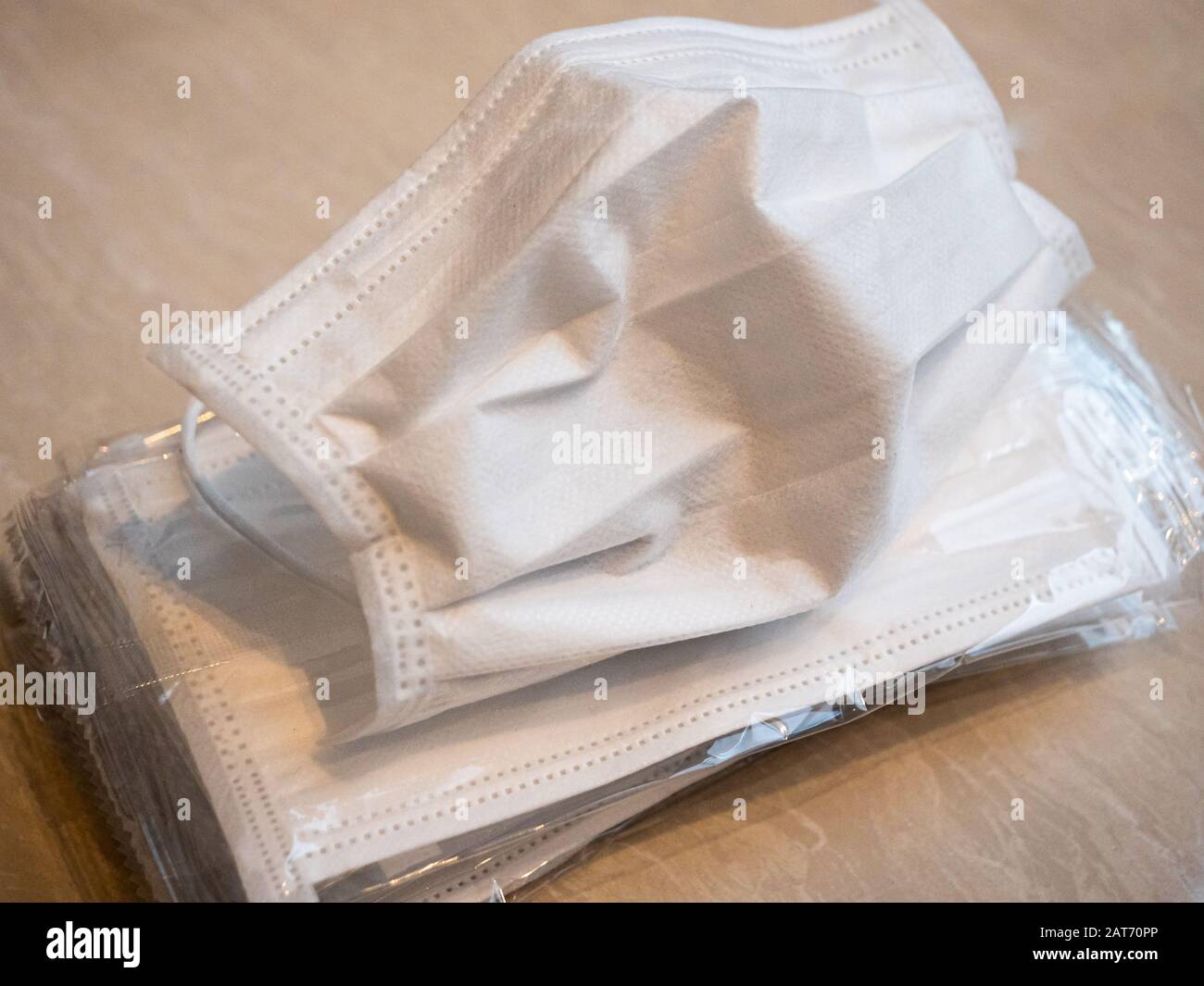 A pile of white surgical masks for flu season Stock Photo - Alamy