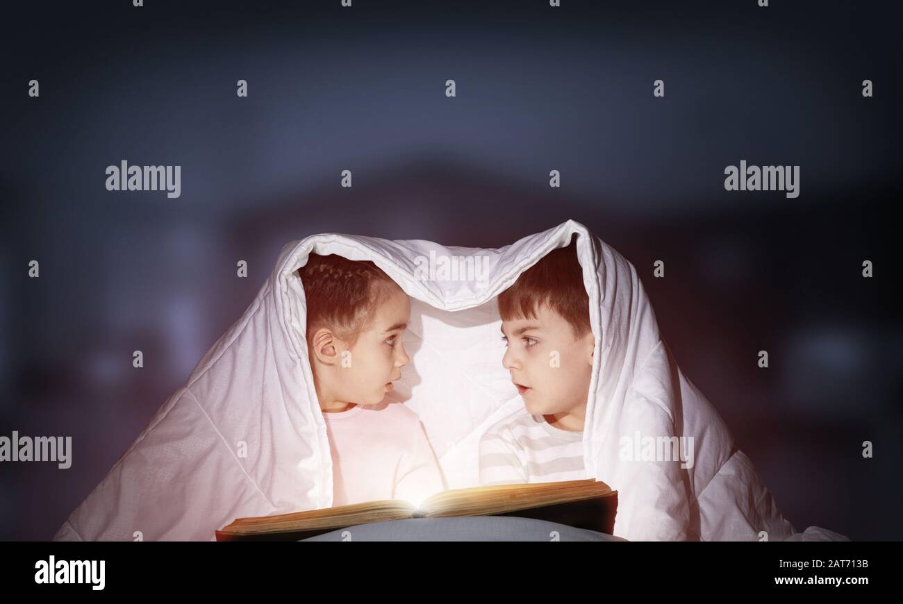 Scared little girl and boy looking at each other Stock Photo - Alamy