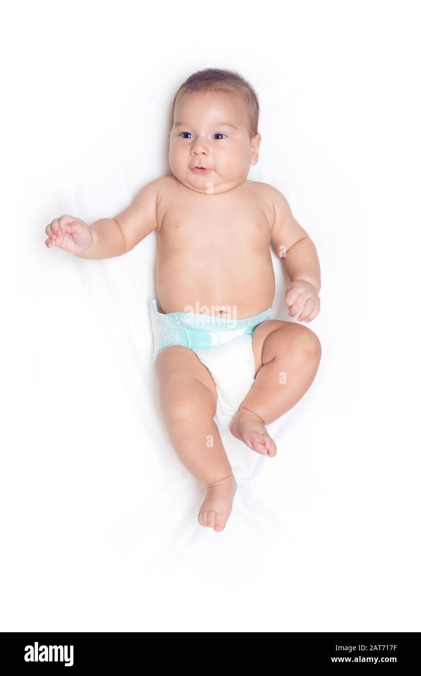 Little beautiful infant baby laying on white background isolated Stock ...