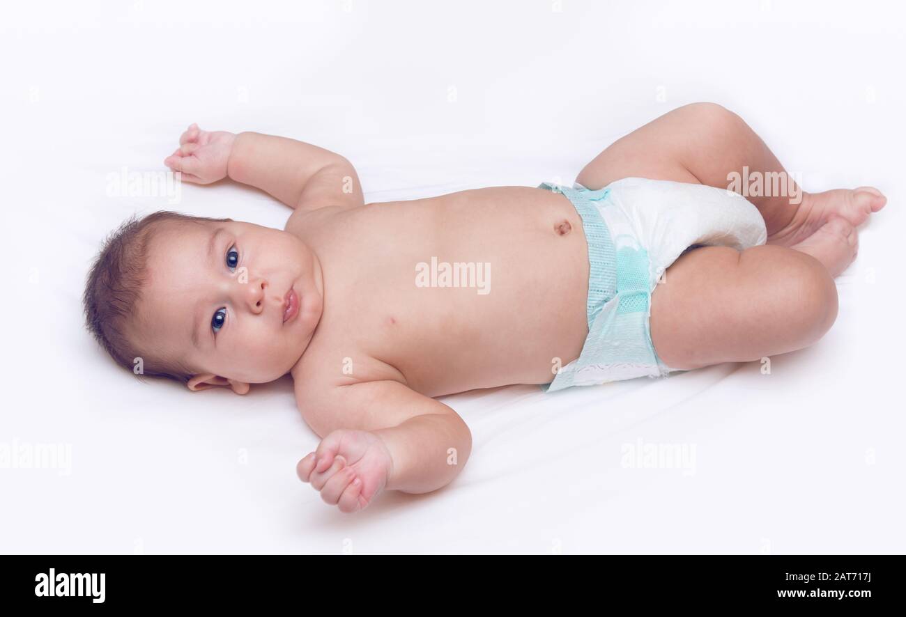 Little beautiful infant baby laying on white background isolated Stock ...