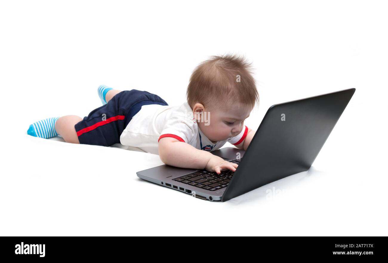 Little baby using laptop (notebook), isolated on white Stock Photo - Alamy