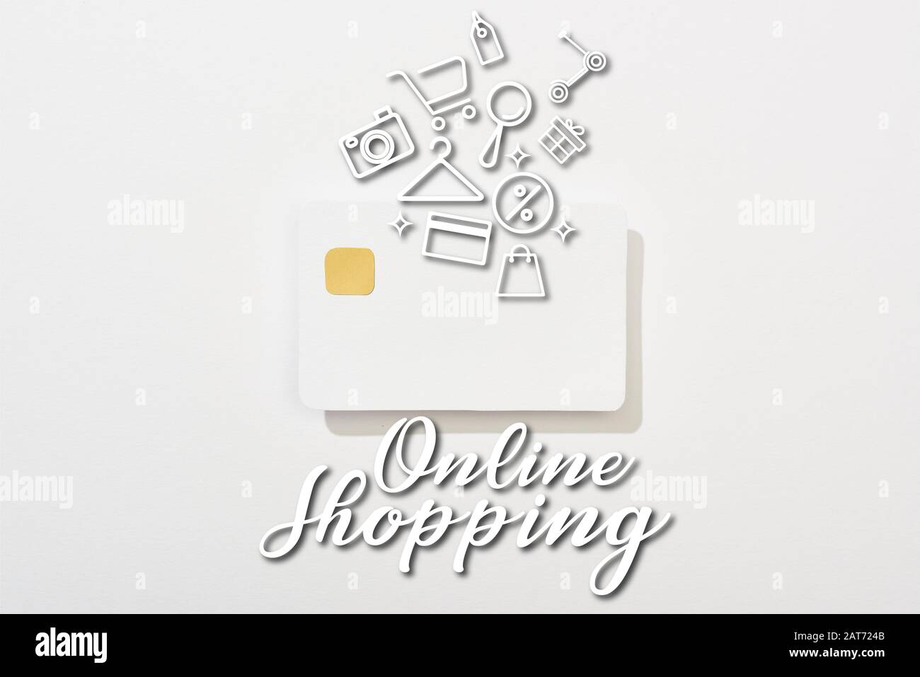 top view of empty credit card on white background with online shopping ...