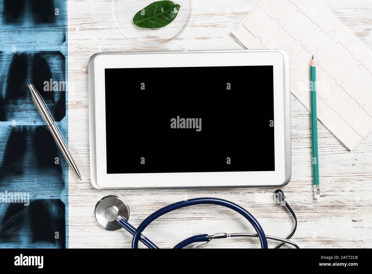 Mock up of doctors desktop with medical supplies Stock Photo - Alamy