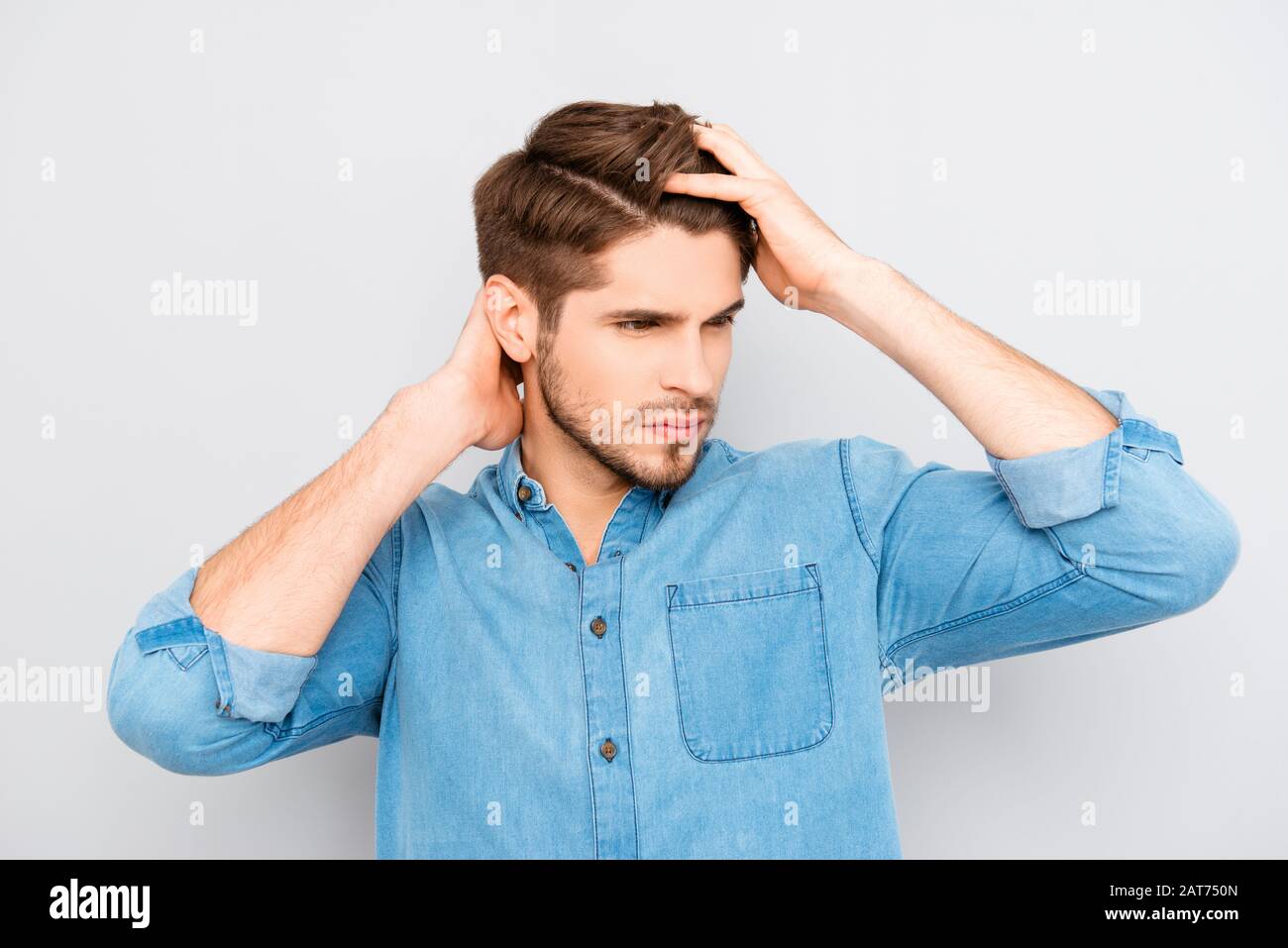 Portrait of healthy man combing his hair with fingers Stock Photo - Alamy