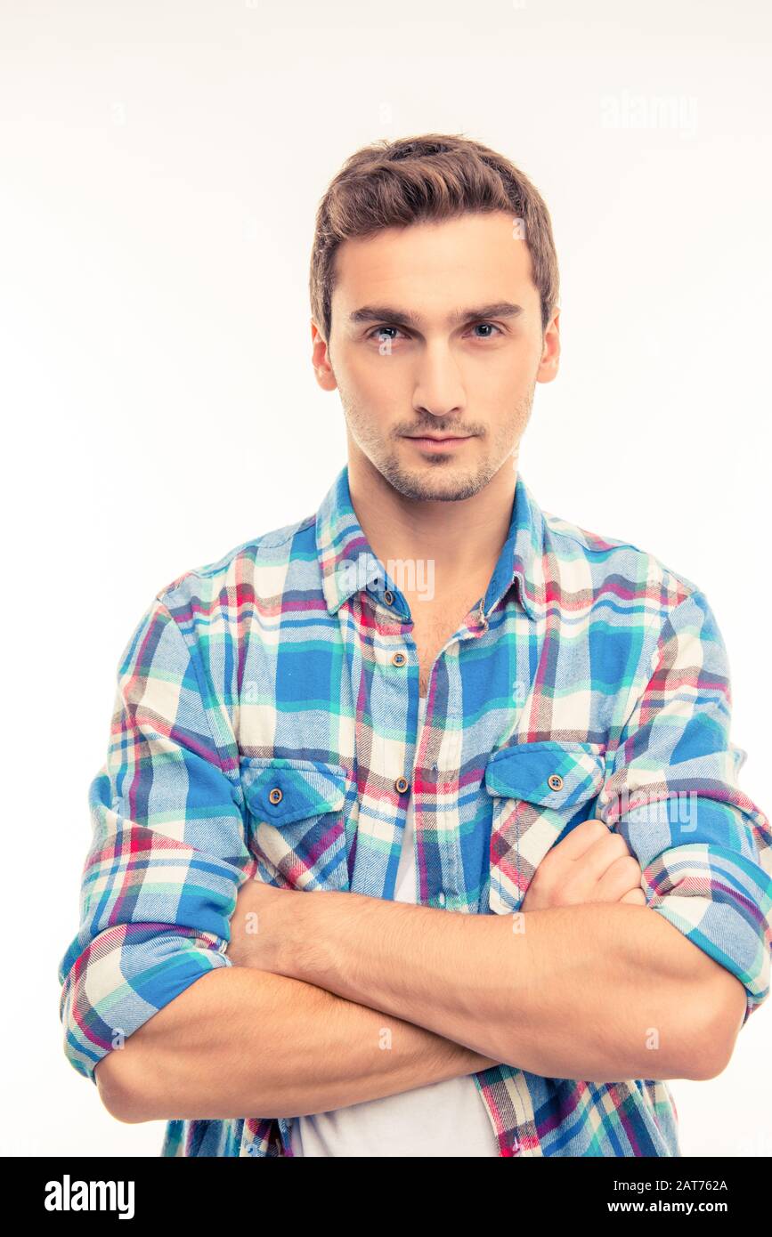 Portrait of a cute handsome young man crossing hands Stock Photo - Alamy