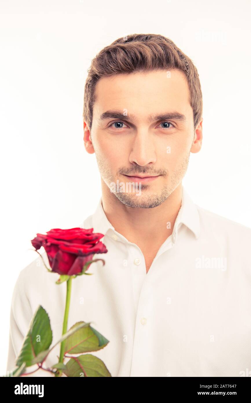 Romantic handsome man with a red rose Stock Photo - Alamy