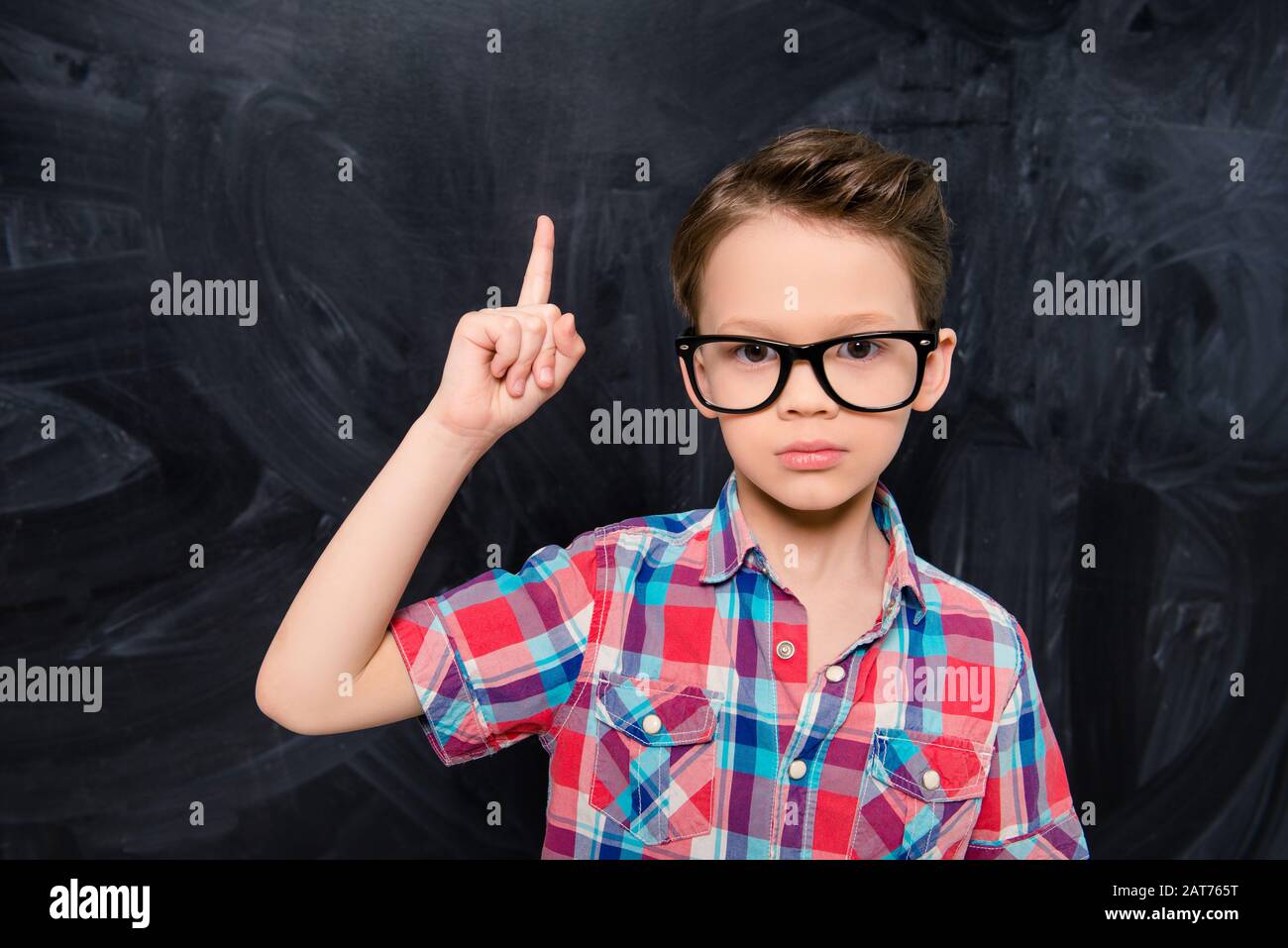 Portrait of little genious in glasses having great idea Stock Photo - Alamy