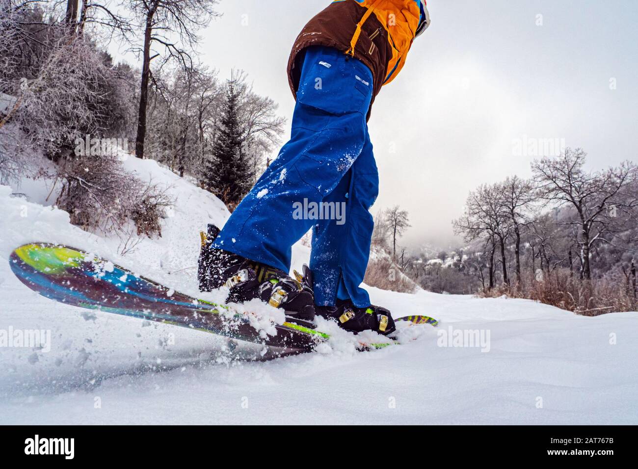 Male snowboarder rides on board hi-res stock photography and images - Alamy