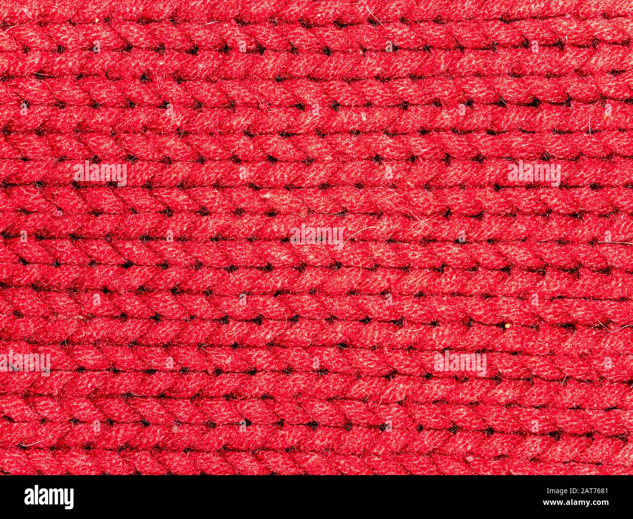 Texture of red woolen knitted fabric. Background image. Place for text ...