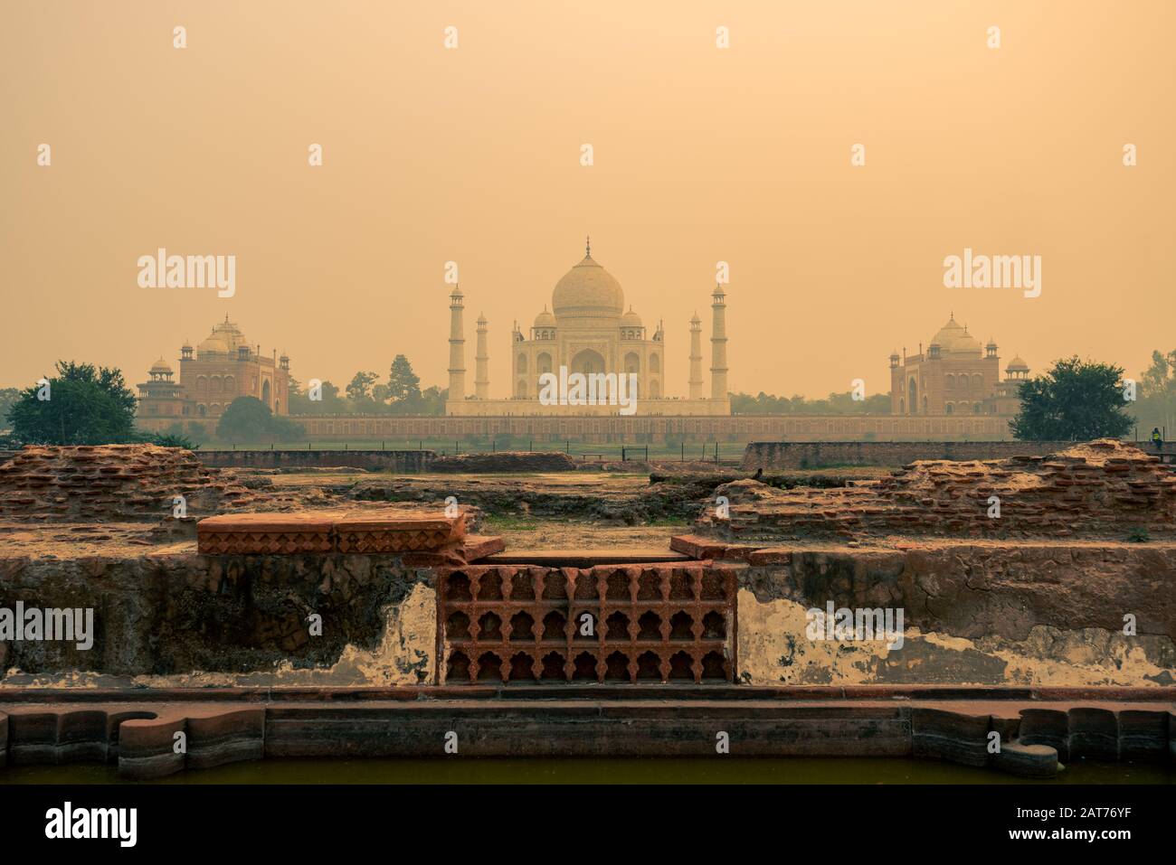 Wide shot of the backside of the Taj Mahal in Agra, India on overcast ...