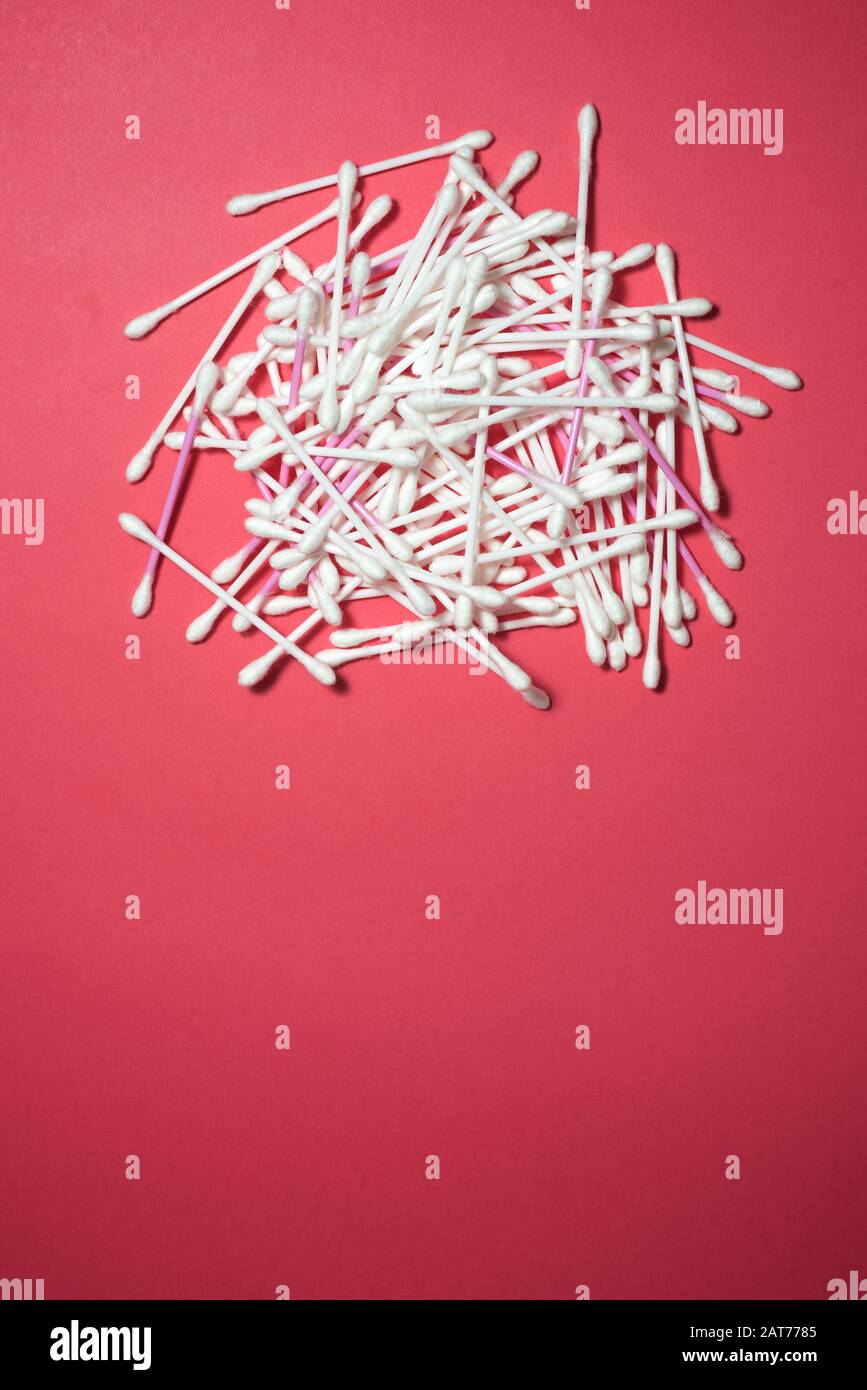 Ear swabs on a pink table Stock Photo - Alamy