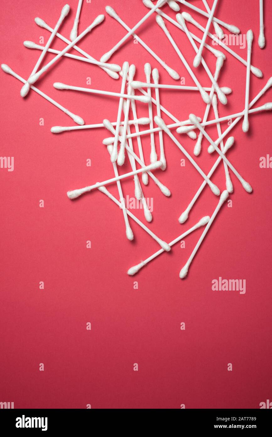 Ear swabs on a pink table Stock Photo - Alamy