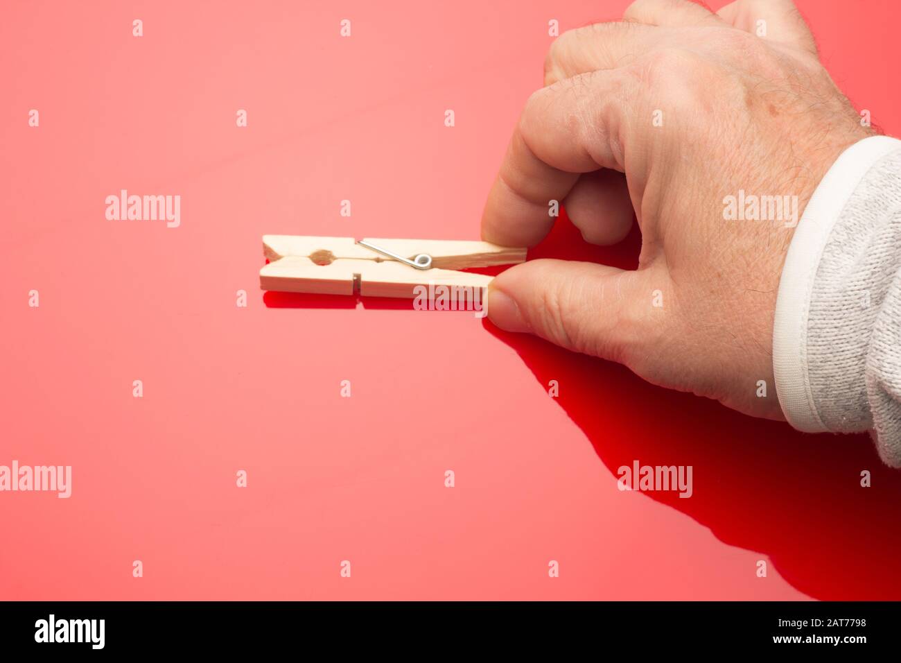 Simple wooden clothespin to hang clothes or hold small things; clamp ...