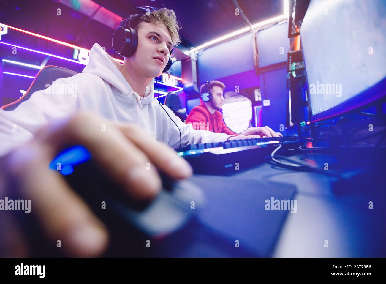 Professional gamer playing tournaments online video games computer with ...