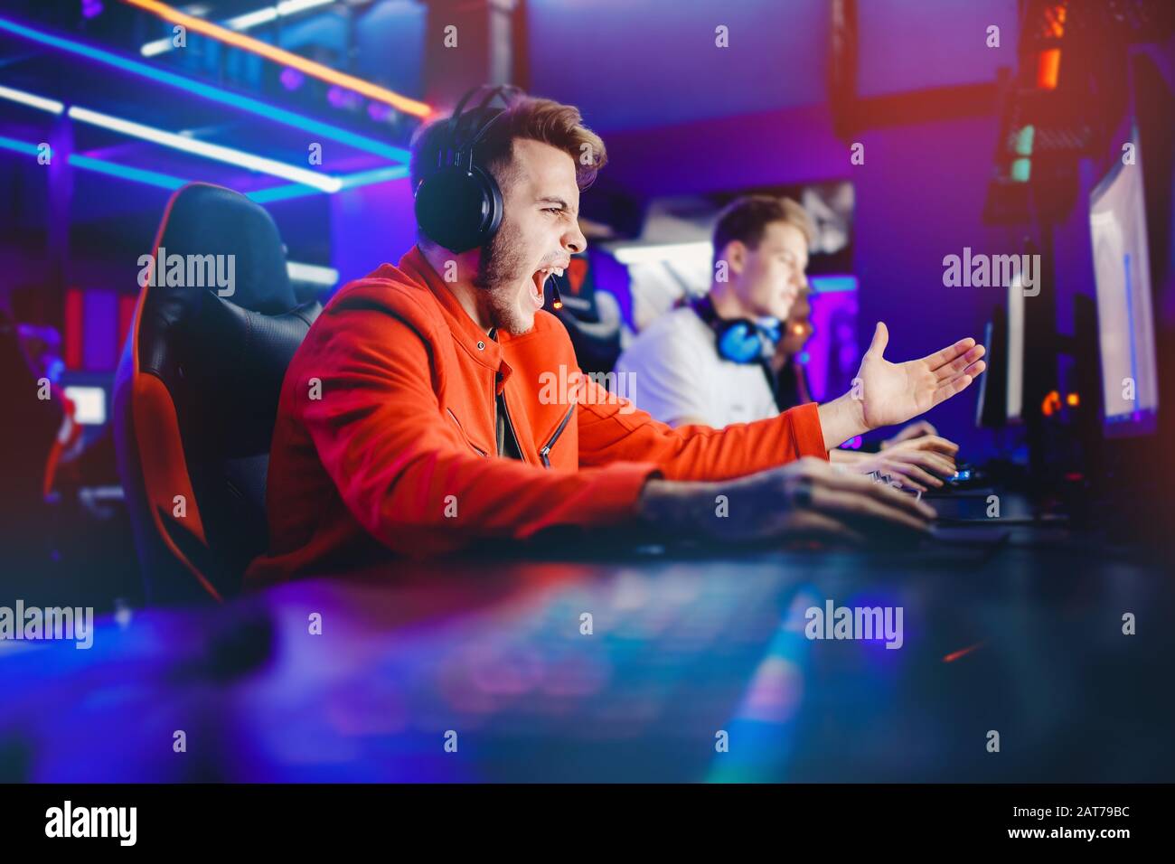 Streamer young man rejoices in victory professional gamer playing ...