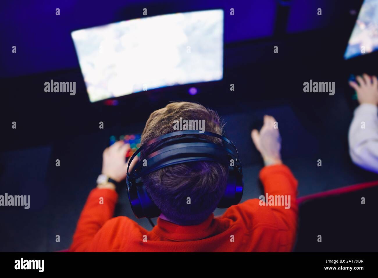 Professional gamer playing online games tournaments pc computer with ...