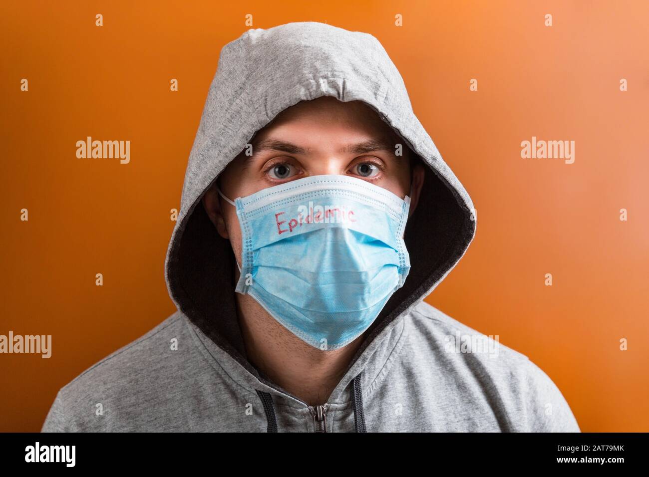 Portrait of a man in hood on his head wearing medical mask with ...