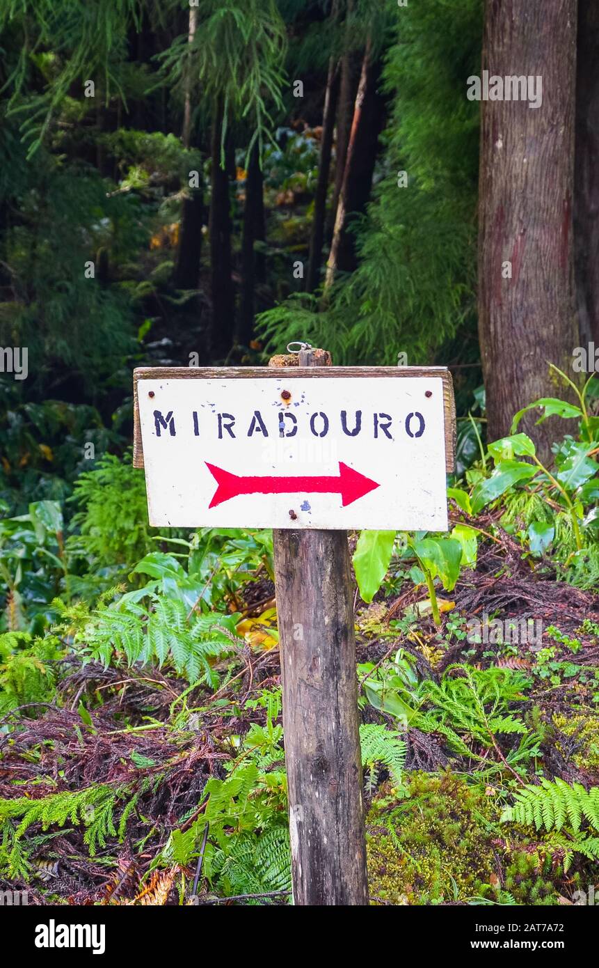 Tourist sign with a red arrow on the white field giving direction to a ...