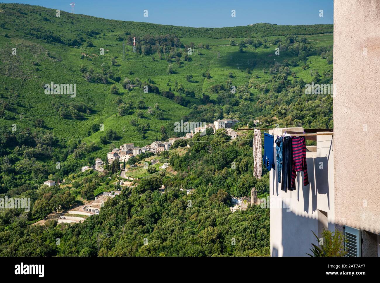 Clothes drying at house, view of Village of Lucciana in Ravin de Salge ...